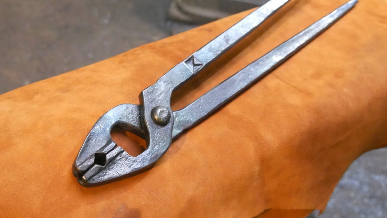 Forging Poz tongs at the anvil