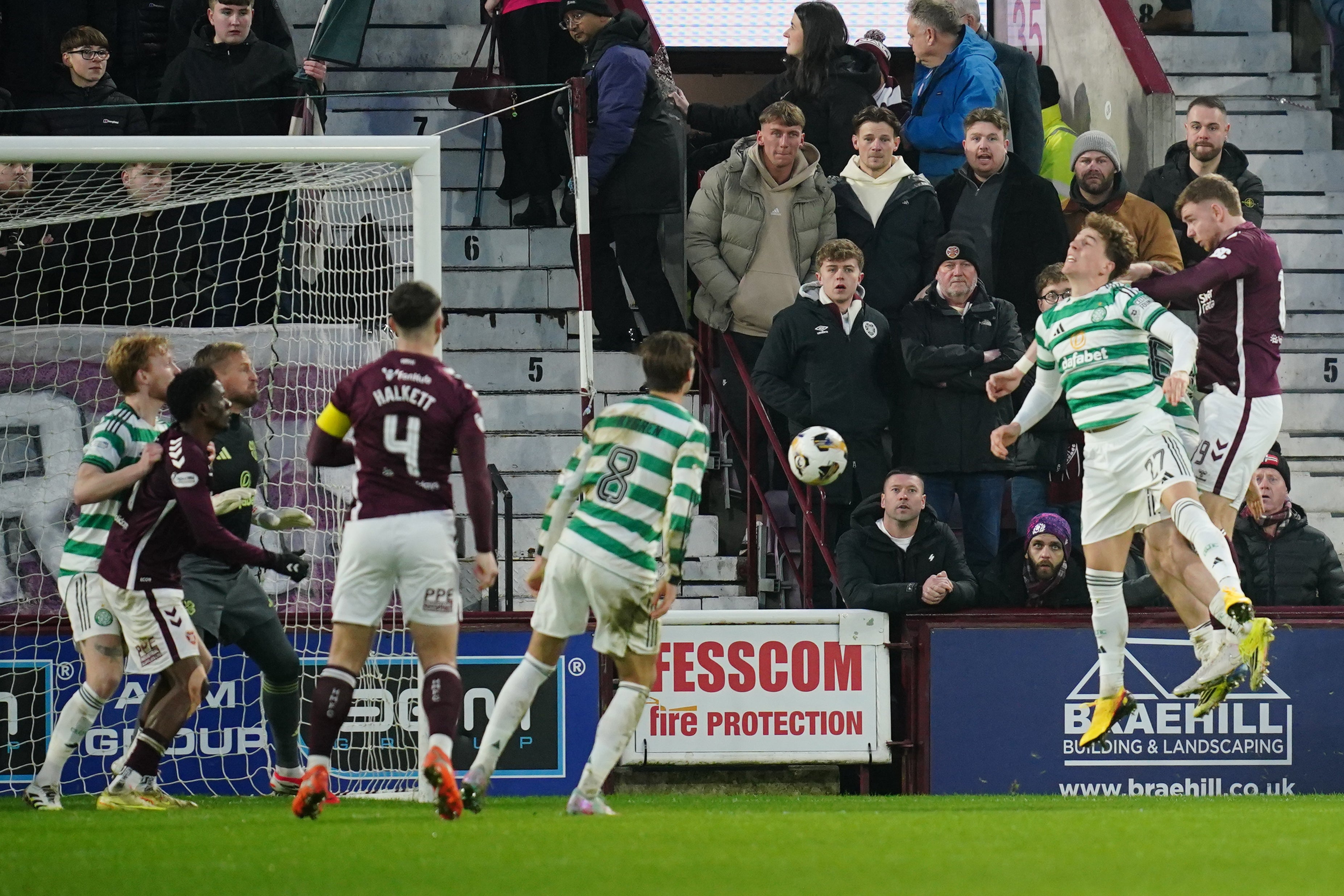 Celtic ahead but down to 10 in thrilling title tussle with Hearts