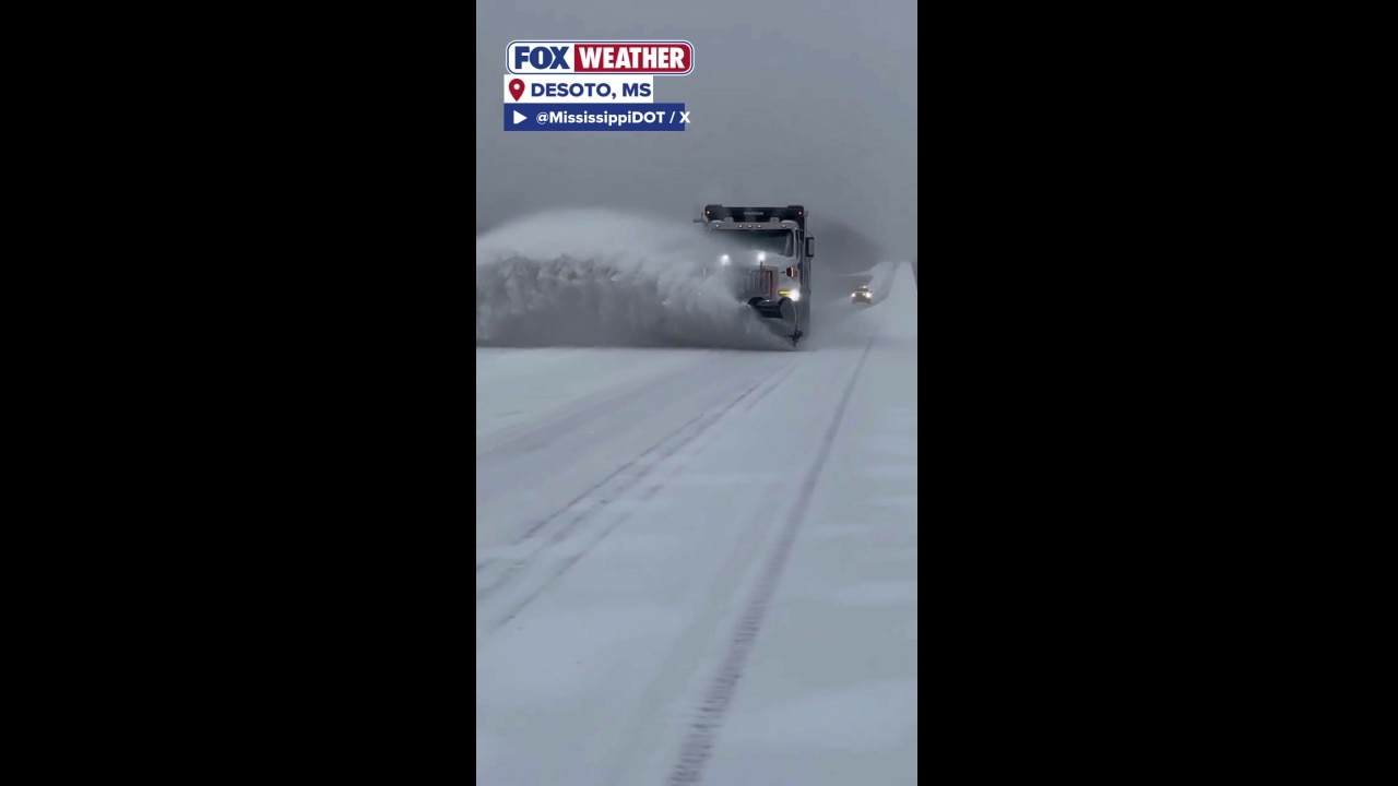 Mississippi Department of Transportation crews clear heavy snow