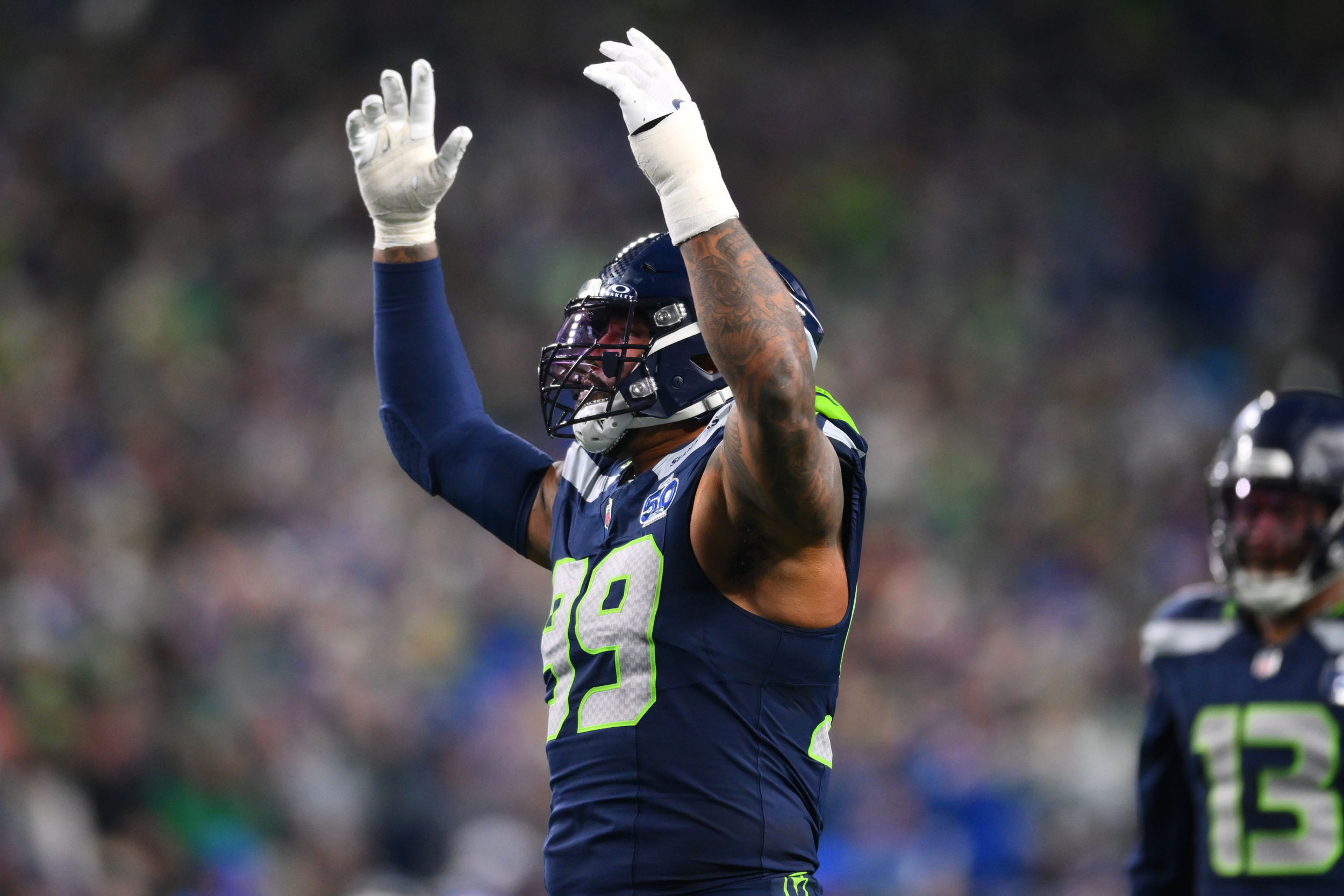 Leonard Williams swipes at Davis Allen during Rams-Seahawks game