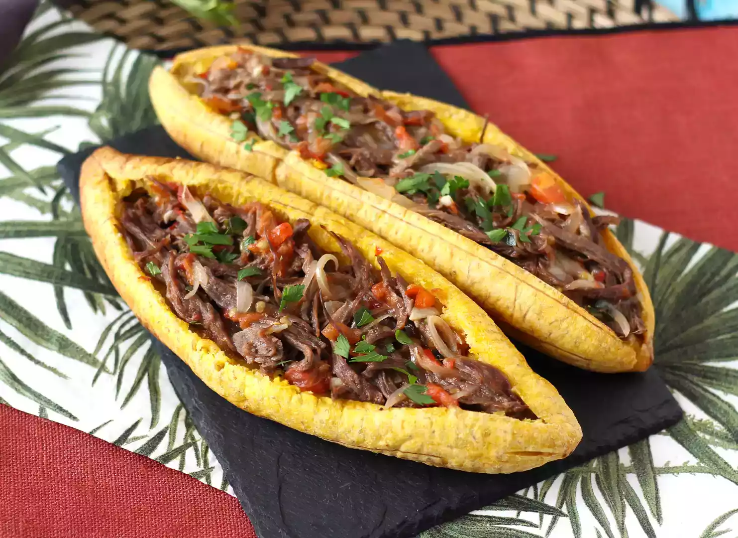 Plantains stuffed with shredded meat and grated cheese