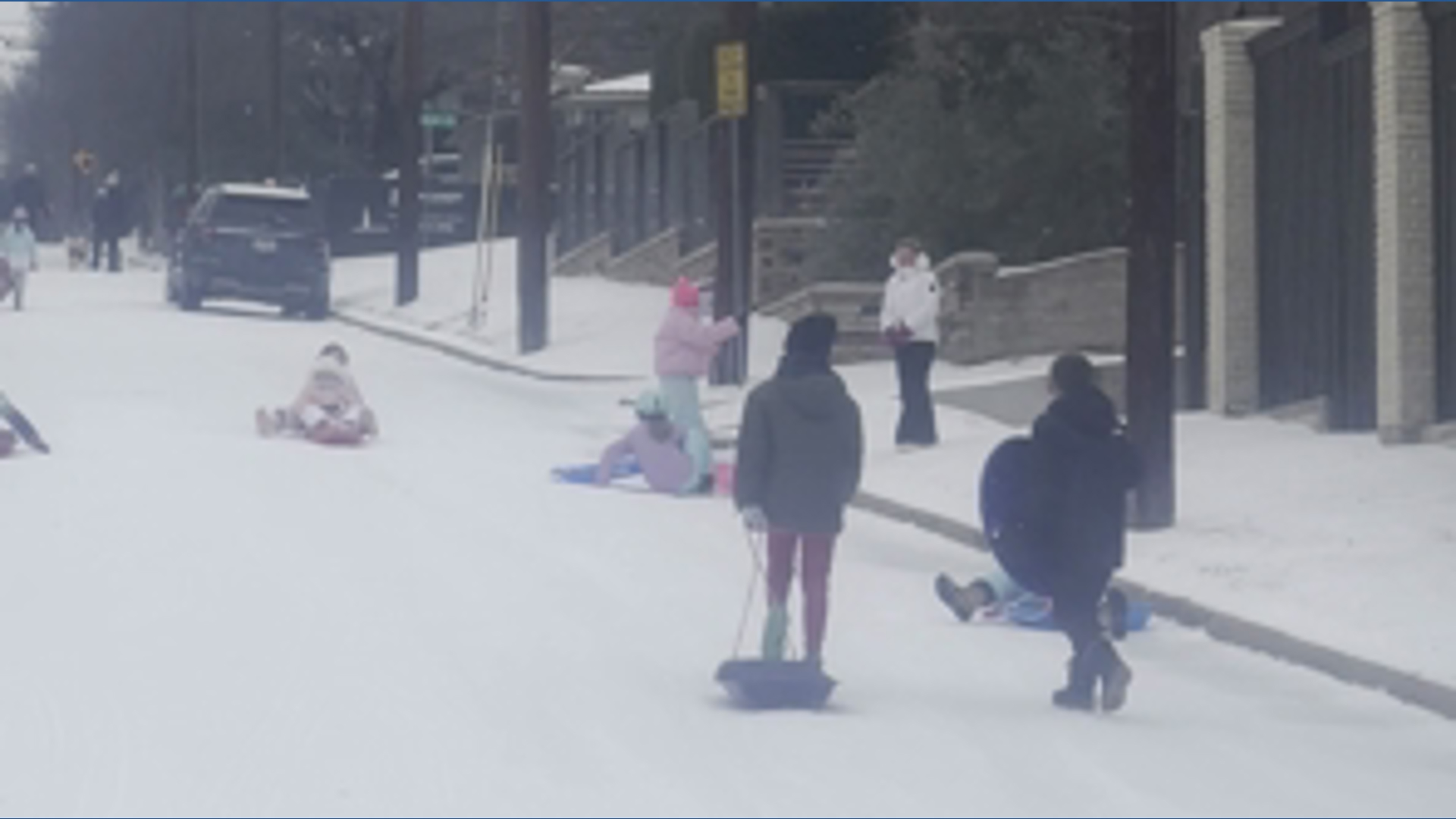Kids sledding through the North Texas snow