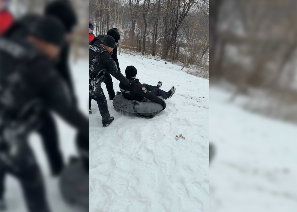 LMPD officers hit the sledding hills with kids at Joe Creason Park