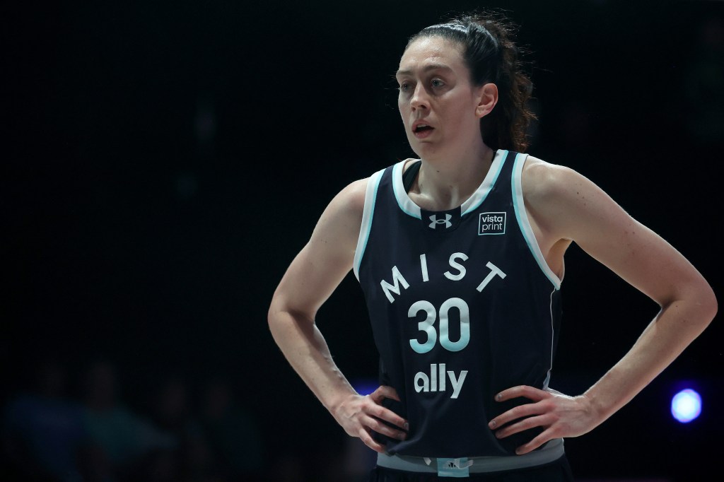 Liberty star Breanna Stewart holds 'abolish ICE' sign before Unrivaled game