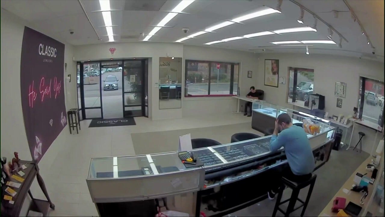 Video shows masked robbers crash car through jewelry store entrance ...