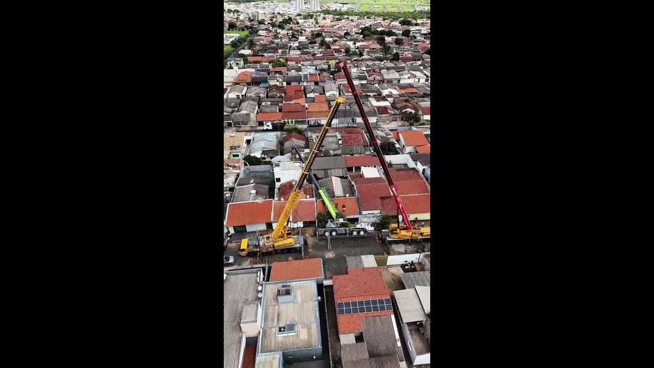 Truck-mounted crane topples over onto homes in Brazil