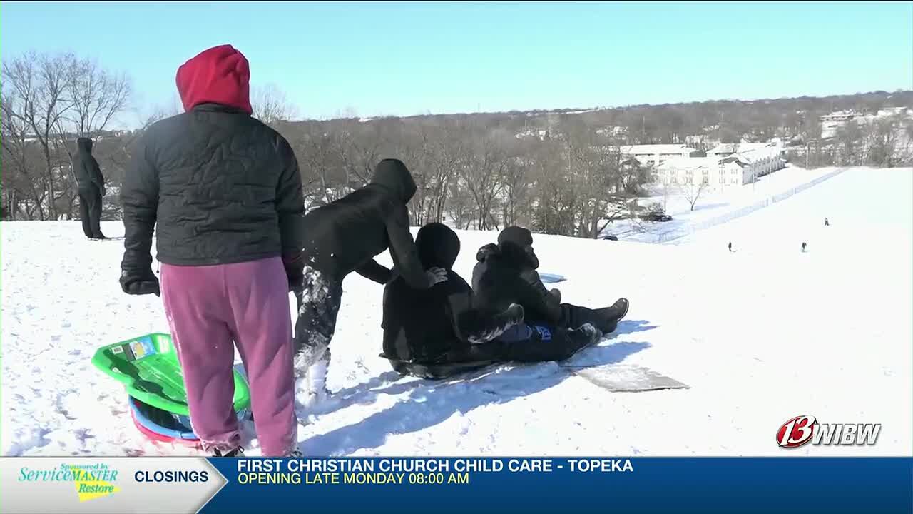 Topekans brave the cold, head out to Quinton Heights Hill to take ...