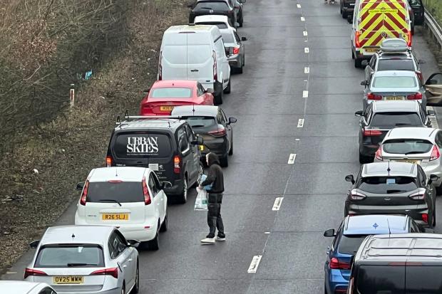 Man spotted handing out food and drink to drivers stuck for hours in ...