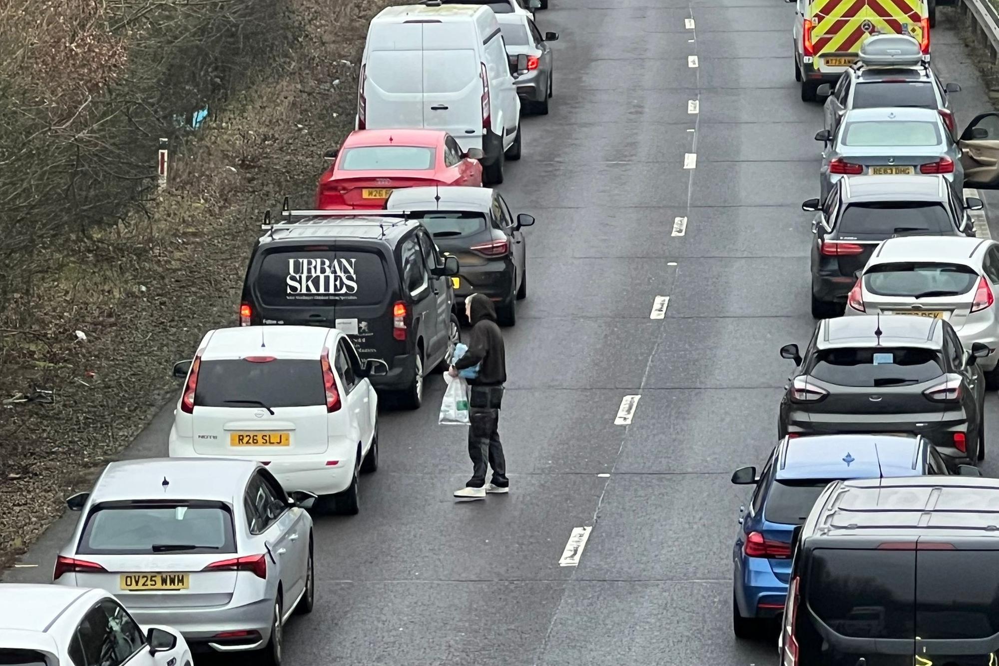 'I'll buy him a pint' - Photos show person handing out crisps and ...