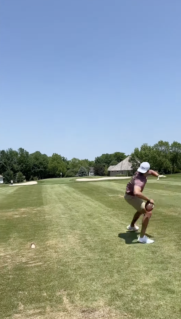 Patrick Mahomes launches two golf balls 100 yards onto the green