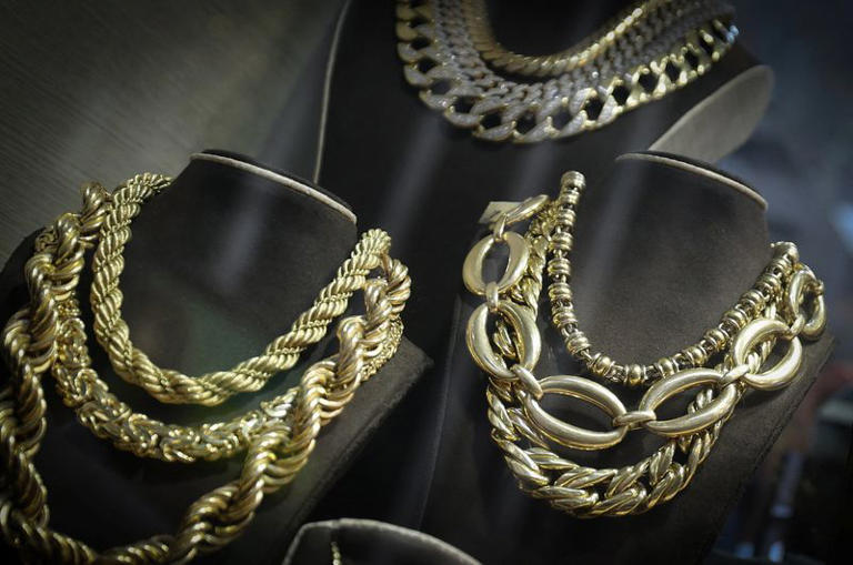 Gold races to $5,100 record peak on safe-haven demand