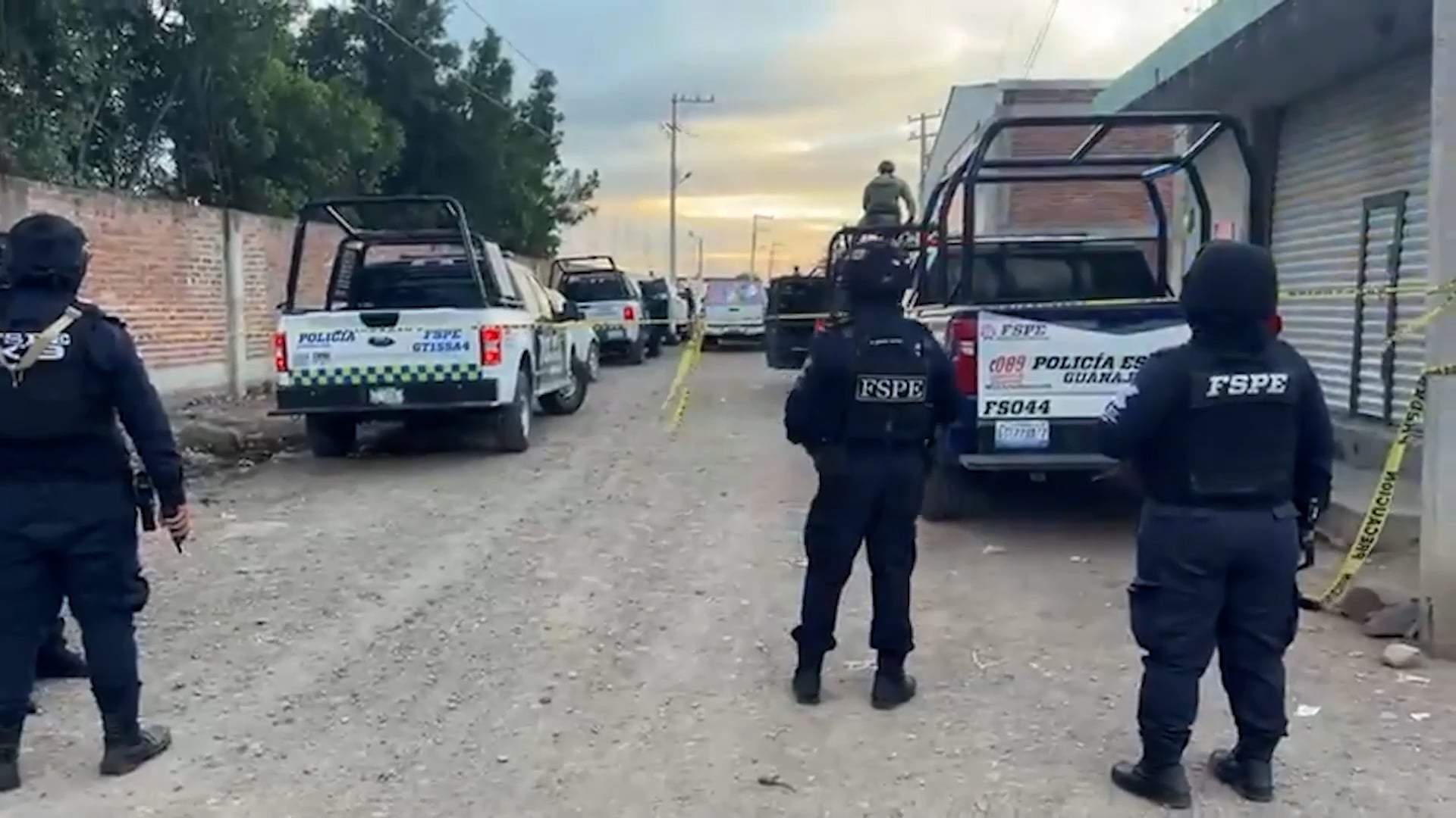 Security personnel patrol scene after gunmen kill 11 at soccer match in ...