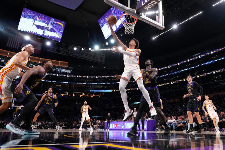 LeBron barely misses triple-double, Luka adds 27 in Lakers' skid ...