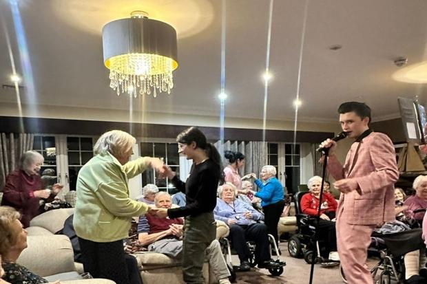 Elvis Presley tribute act brings energy to Wells care home