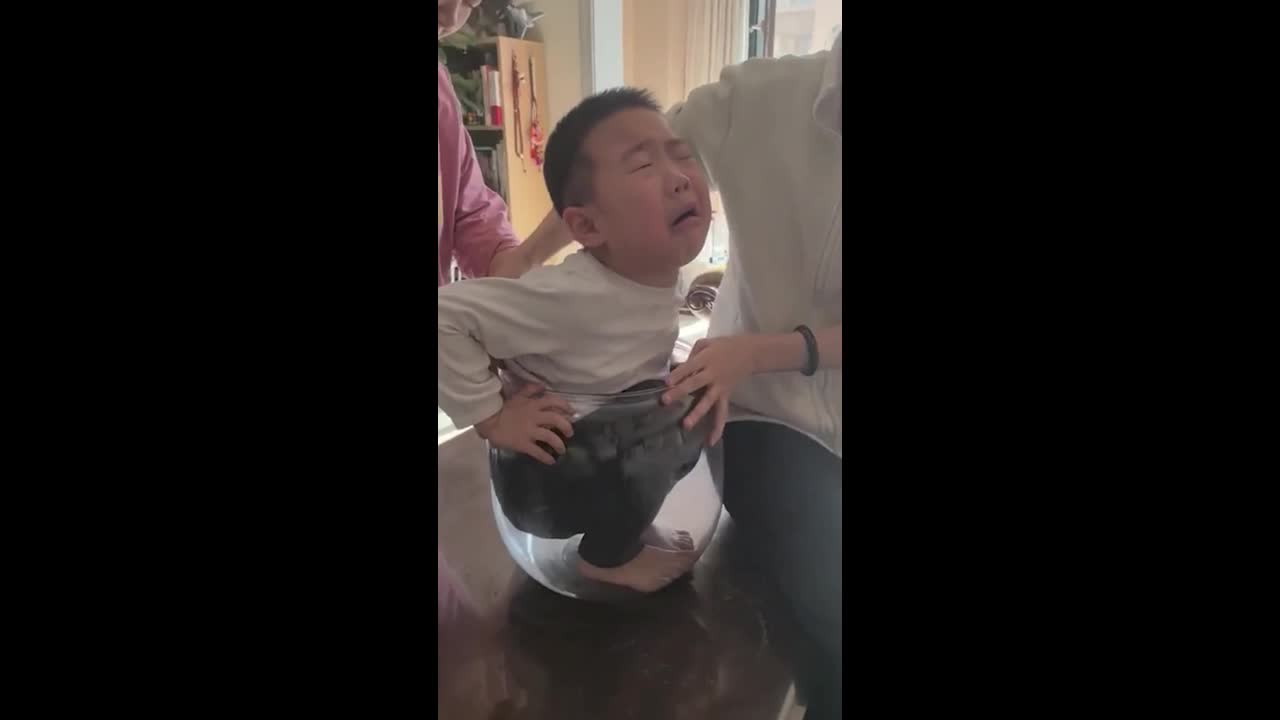 Toddler becomes trapped inside toy bucket in China