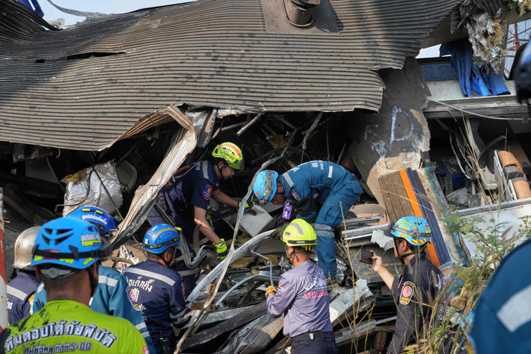 A construction crane falls onto a moving train in Thailand, killing at ...