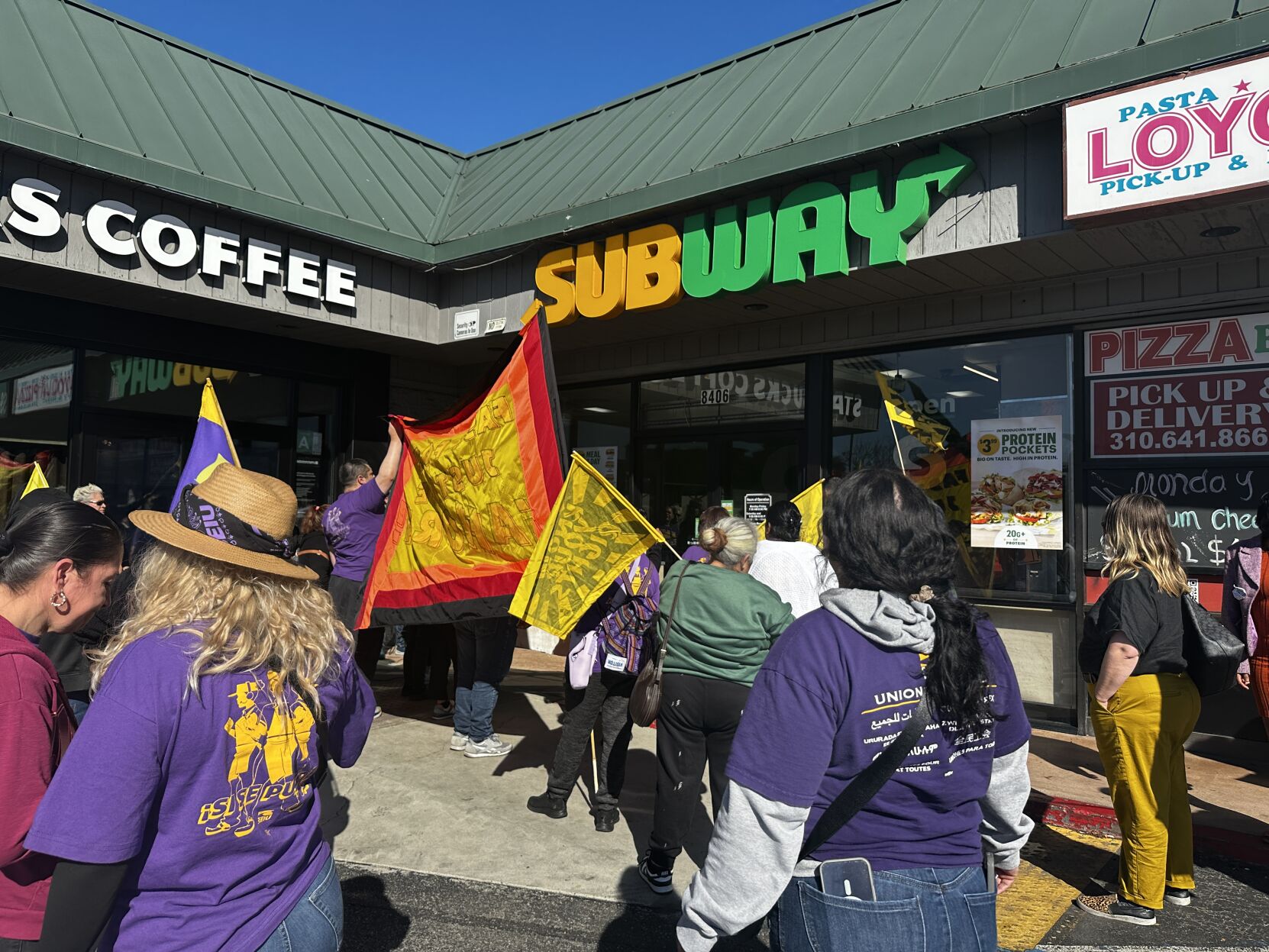 Alleged wage theft prompts march outside two Subway locations