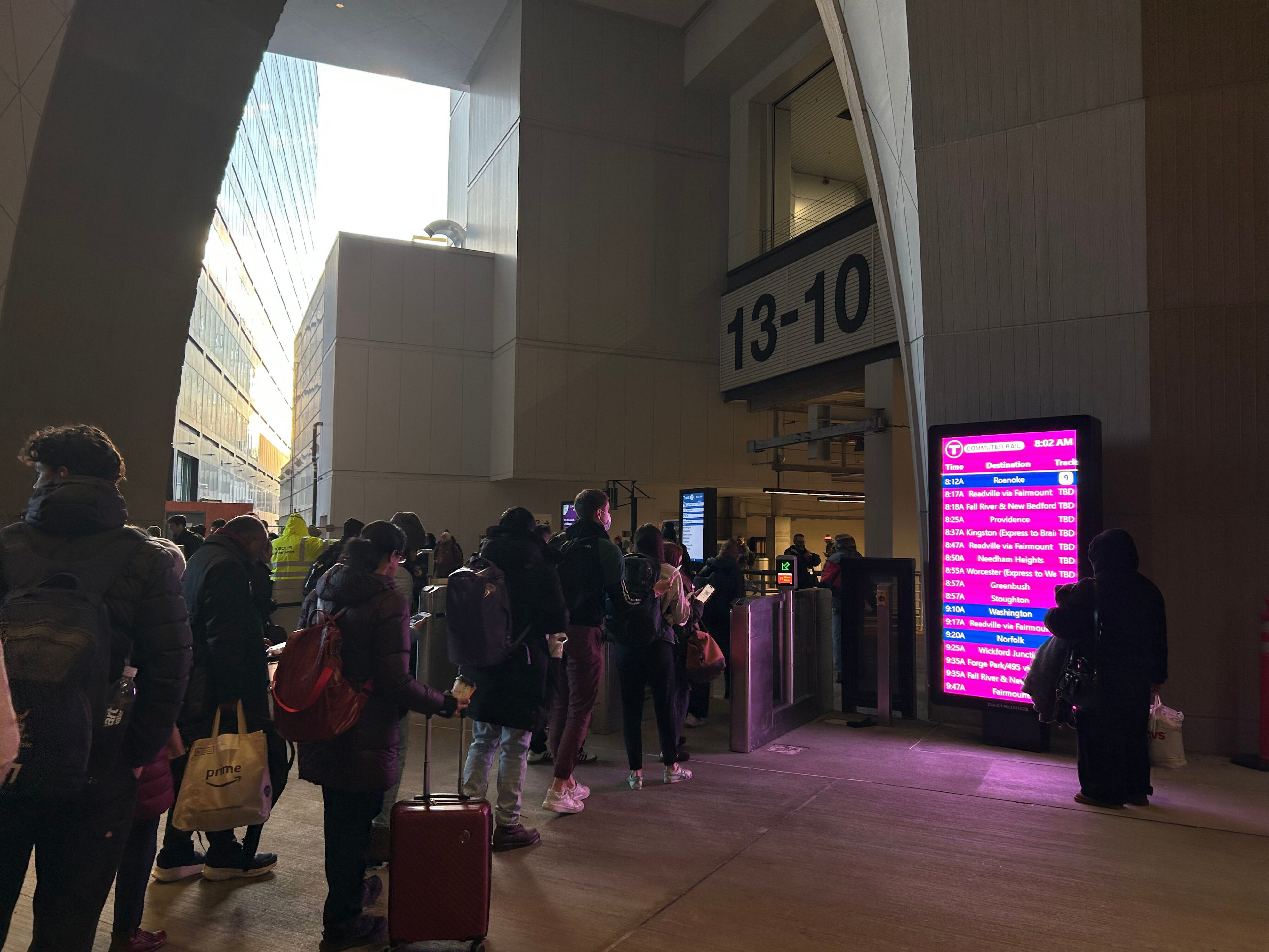 Lines at South Station fare gates as commuters adjust to new system ...
