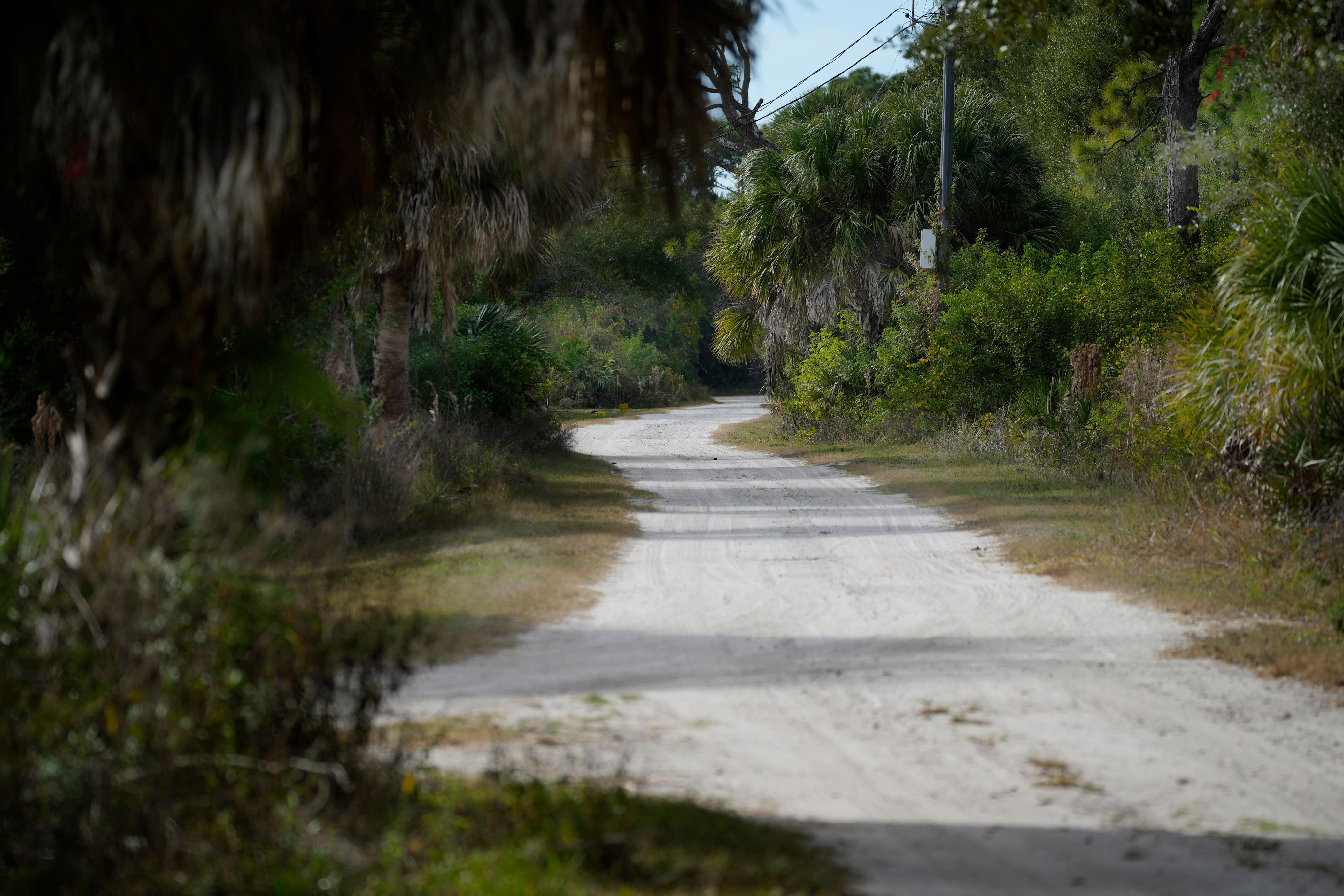 Why is Sarasota County paying Pat Neal $15 million to build a road?