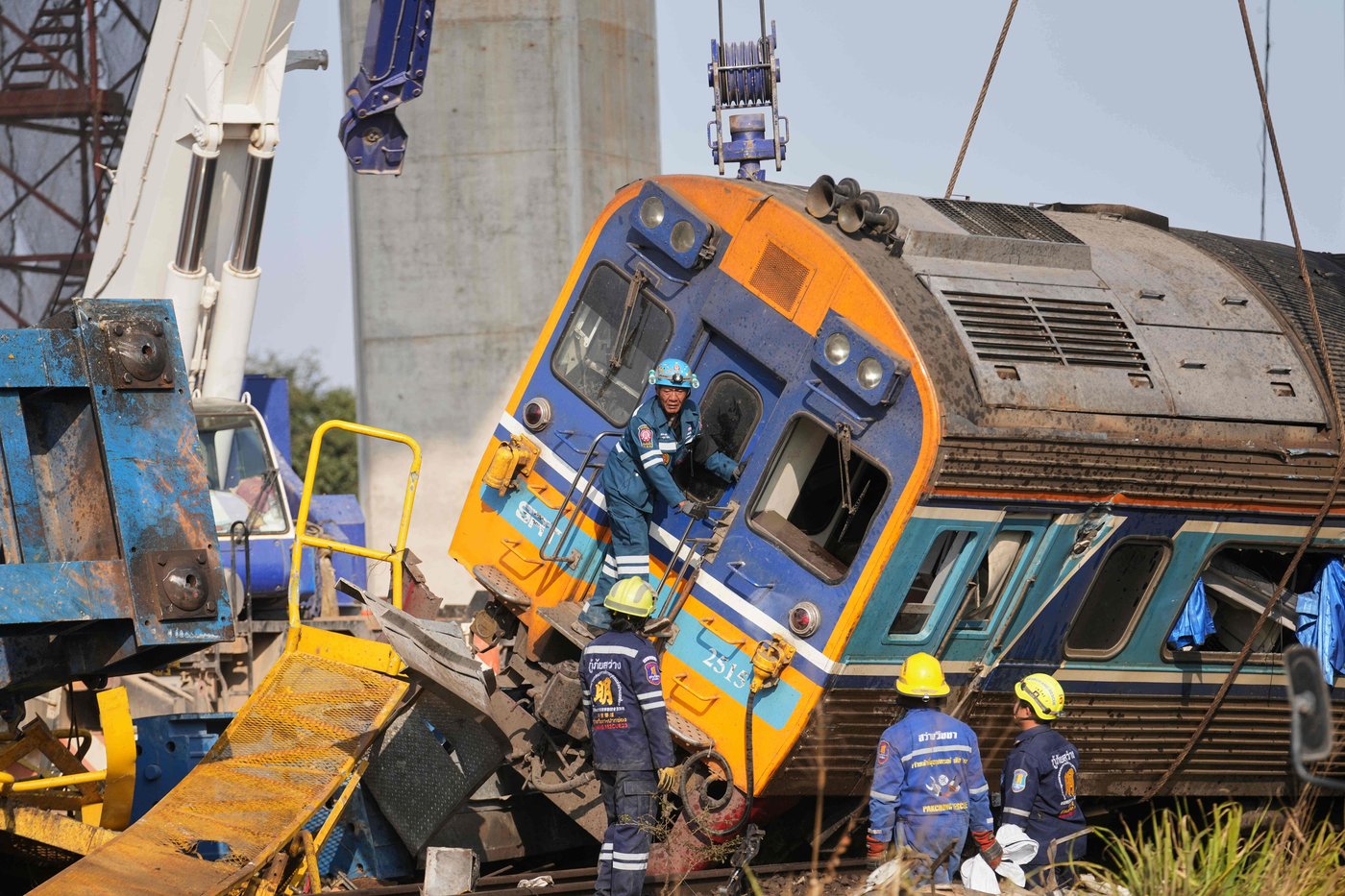 A construction crane falls onto a moving train in Thailand, killing at ...