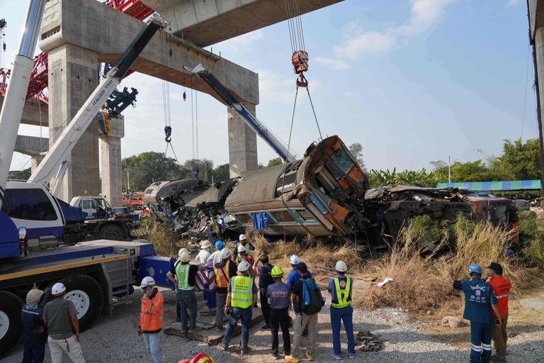 A construction crane falls onto a moving train in Thailand, killing at ...