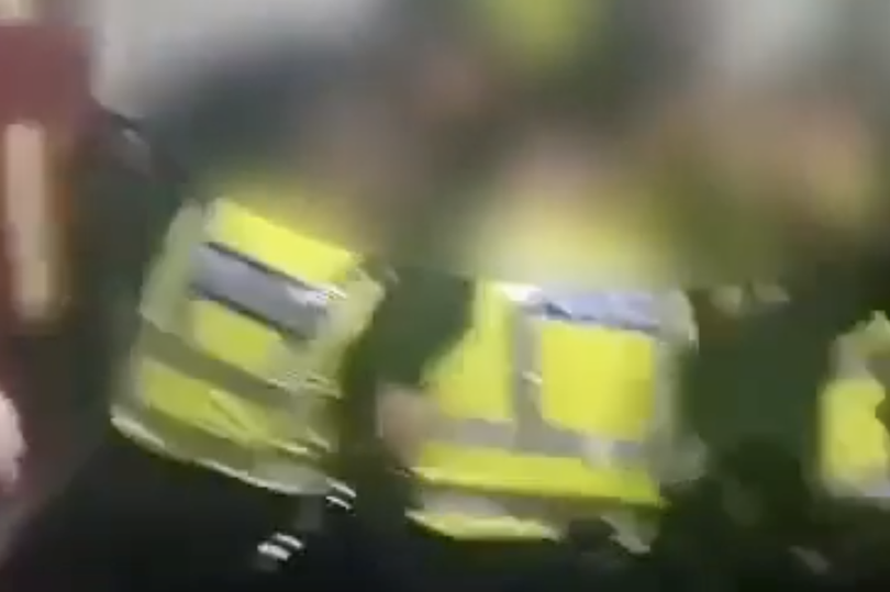 Man 'restrained by eight police officers' while taking bins outside ...