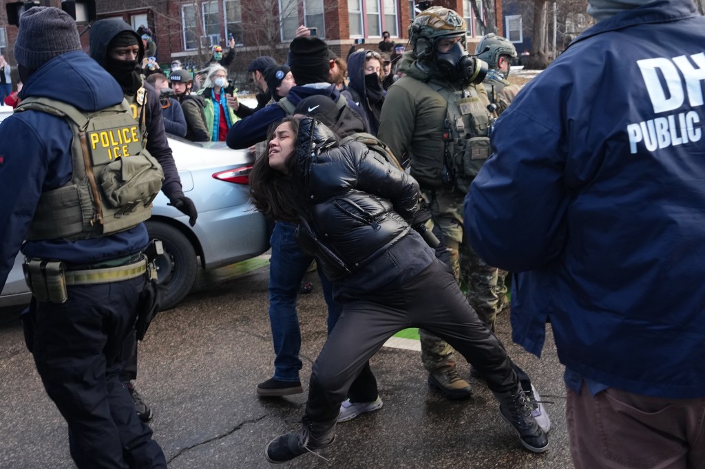ICE agents haul driver out of car as Minnesota protesters swarm them in ...