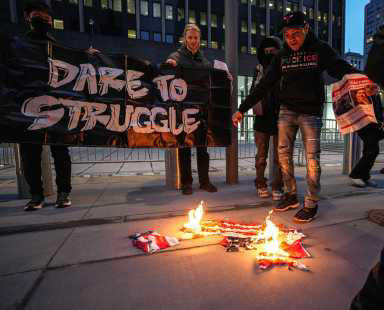 Radical anti-ICE protesters burn flags outside Manhattan immigration ...