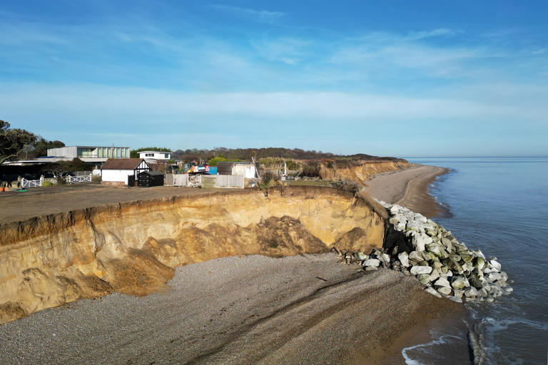 Aerial images show demolition of fourth clifftop home amid coastal erosion