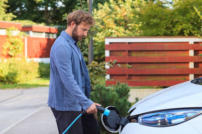 Driveway divide warning with two-tier system for EVs