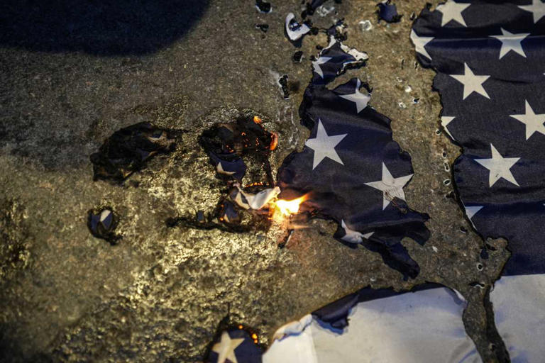 Radical anti-ICE protesters burn flags outside Manhattan immigration ...