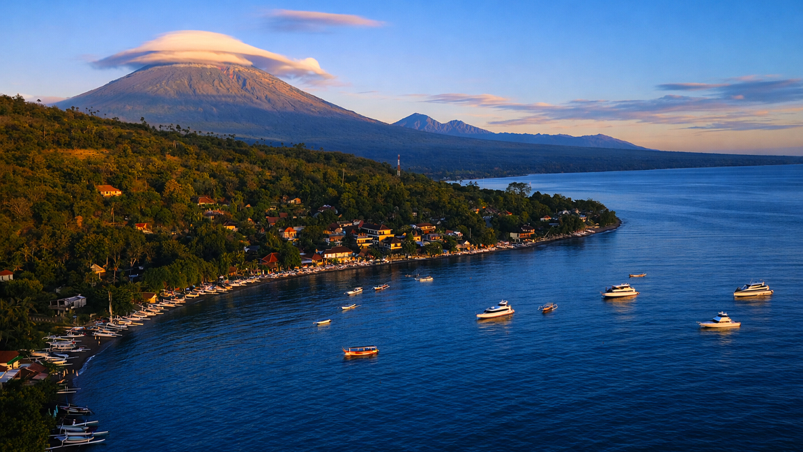 Boats rest beneath sleeping volcano