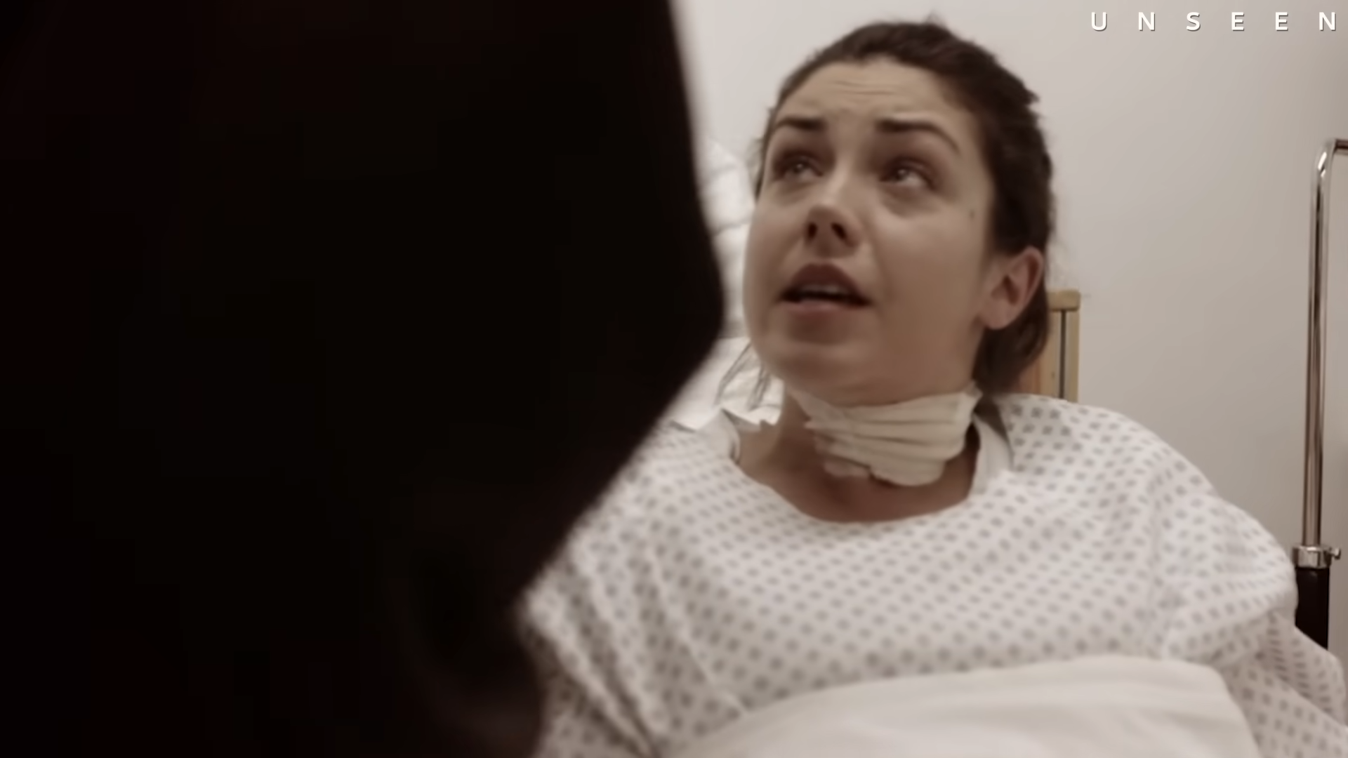 Her eye was swollen. Her hands were shaking. And he was watching