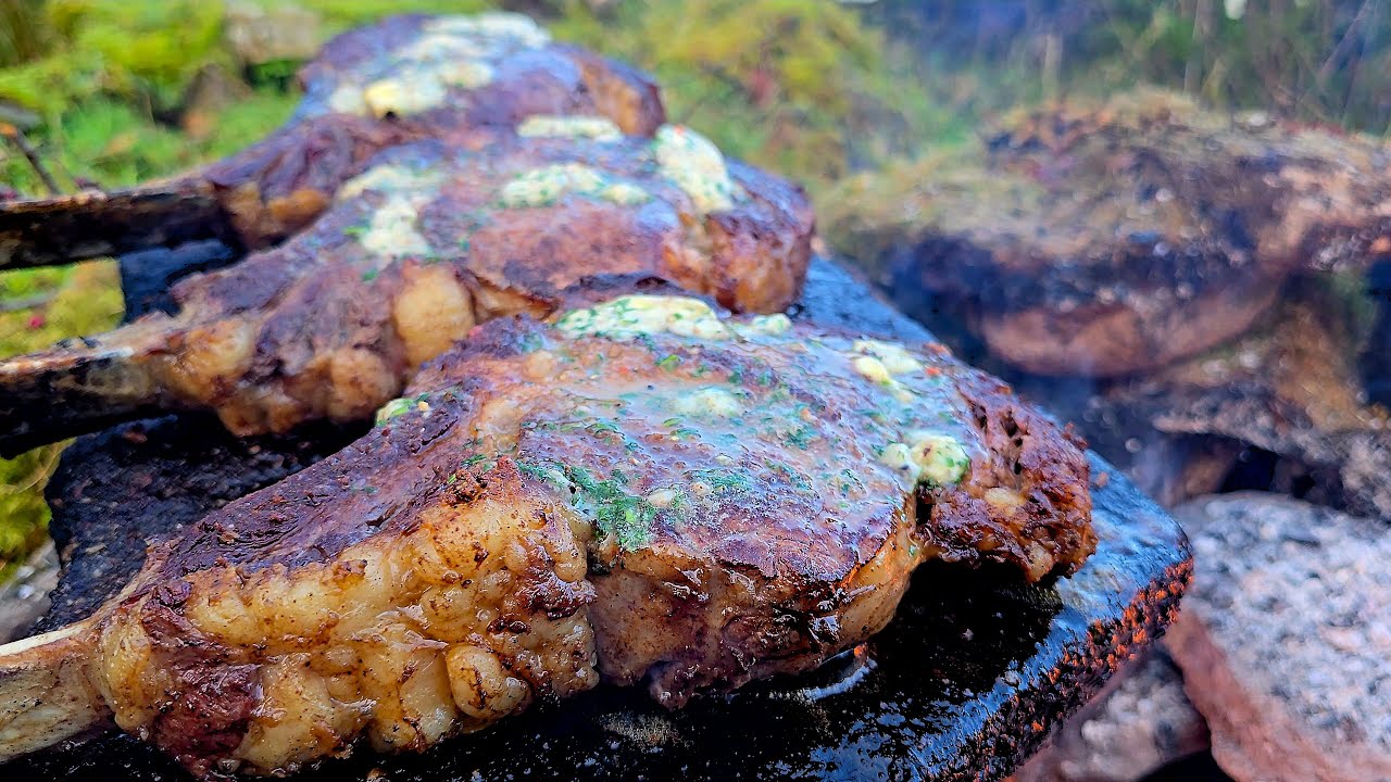 Garlic butter tomahawk on hot stone