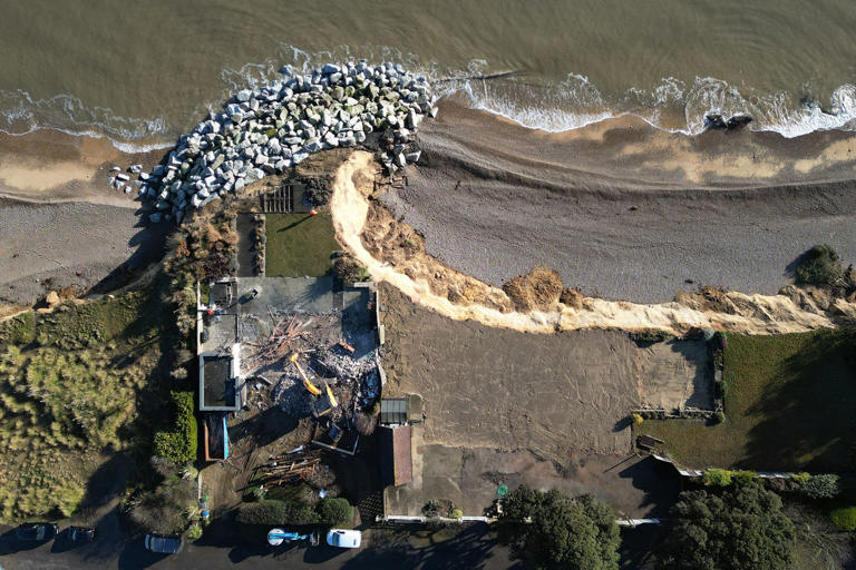 Aerial images show demolition of fourth clifftop home amid coastal erosion