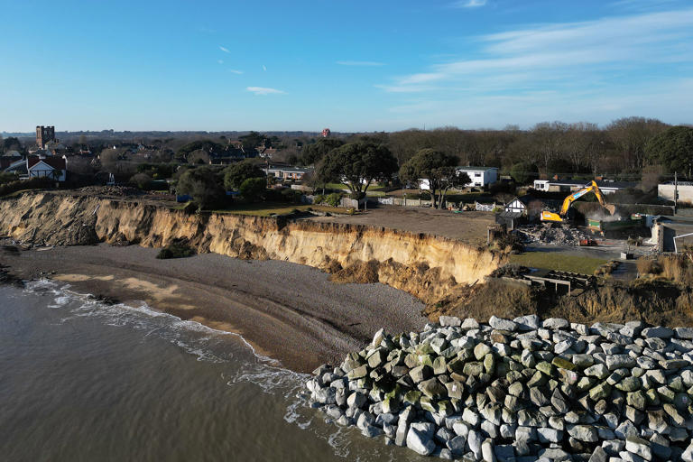Aerial images show demolition of fourth clifftop home amid coastal erosion