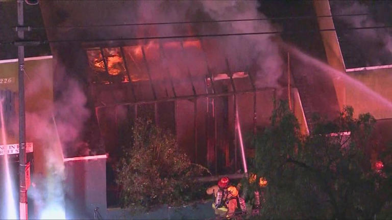 San Fernando Valley church fire still burning as families, children ...