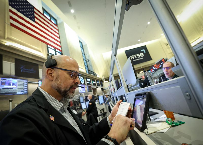 Wall Street falls on bank share pullback, uncertainty boosts gold, oil