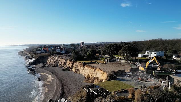 Aerial images show demolition of fourth clifftop home amid coastal erosion