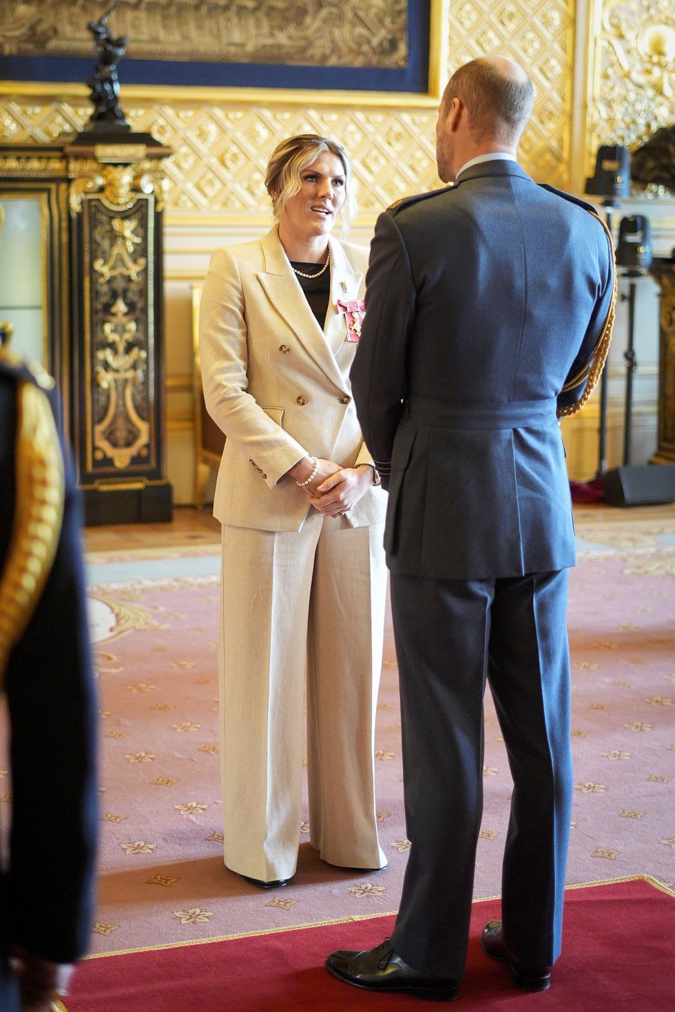 England legend skips training session to receive OBE from Prince William