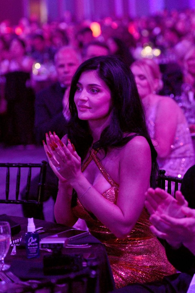 Kylie Jenner is swaddled up in her bodycon optical illusion cocoon dress