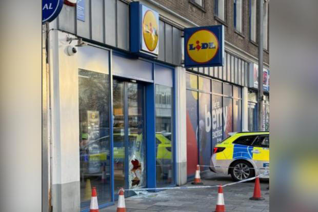 Police tape off Lidl after window smashed in city centre burglary