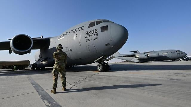 US reduces some personnel at Qatar airbase as Trump threatens action in ...