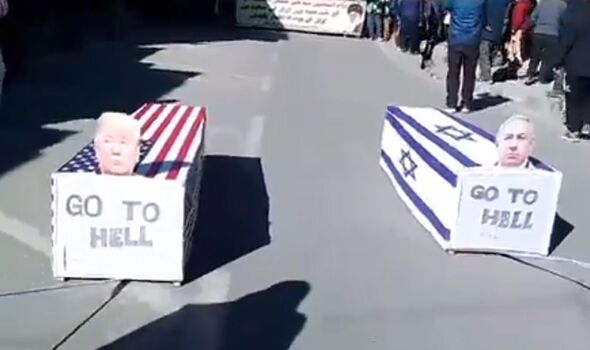 Iranians drag coffin with Trump's face on it through streets - 'Go to ...