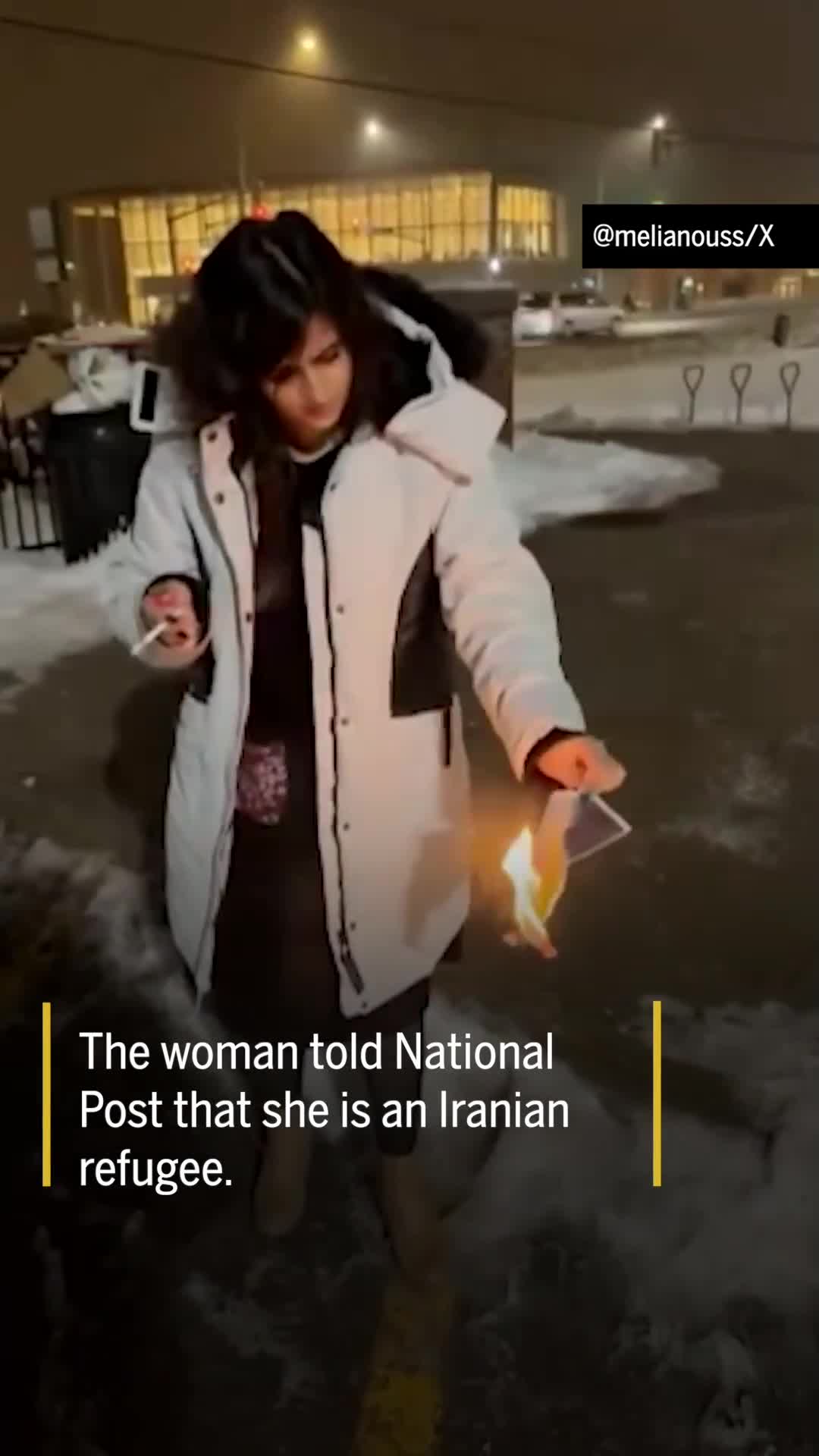 Canadian woman lights cigarette with photo of Iran's leader