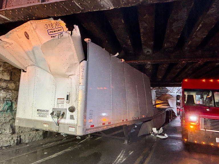 Truck’s roof ripped off after hitting railroad bridge in DeWitt