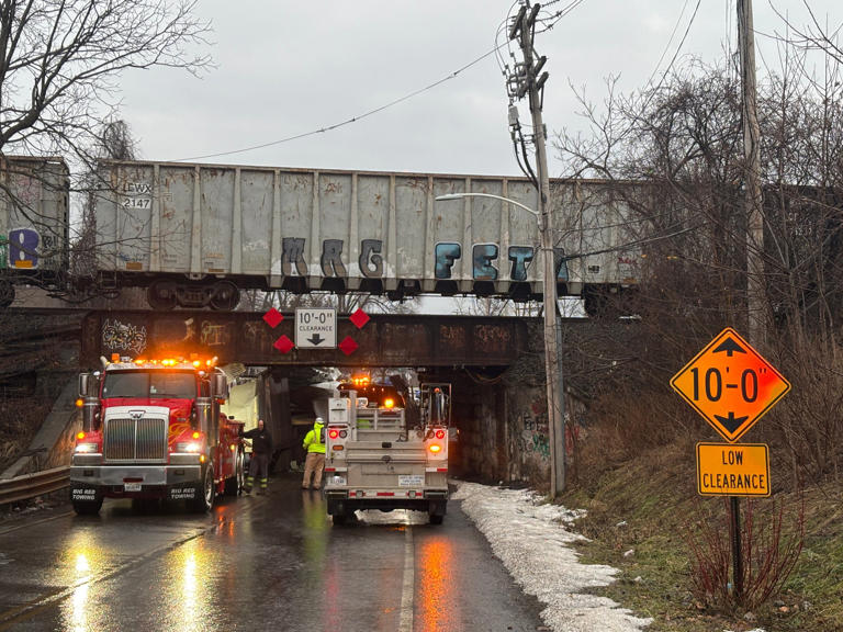 Truck’s roof ripped off after hitting railroad bridge in DeWitt
