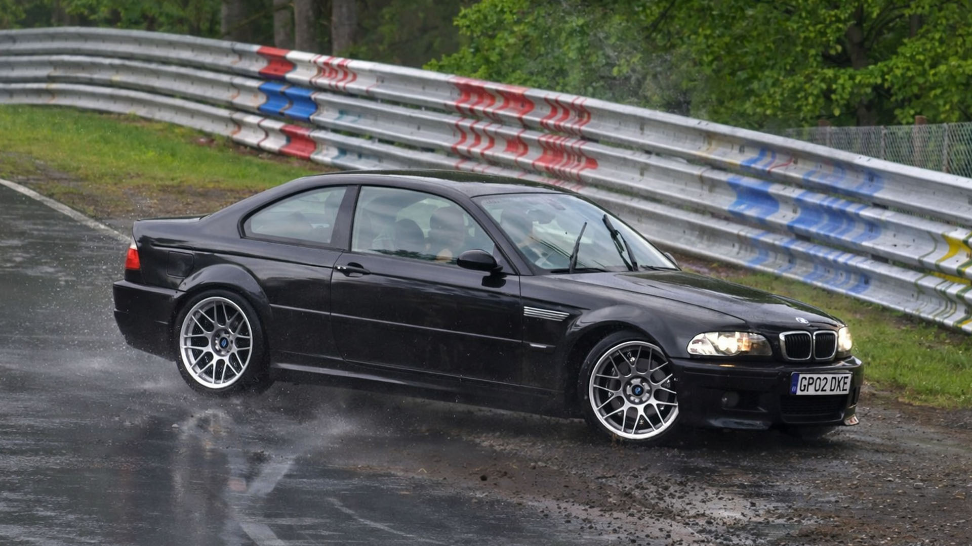 Car slips on wet track during Touristenfahrten