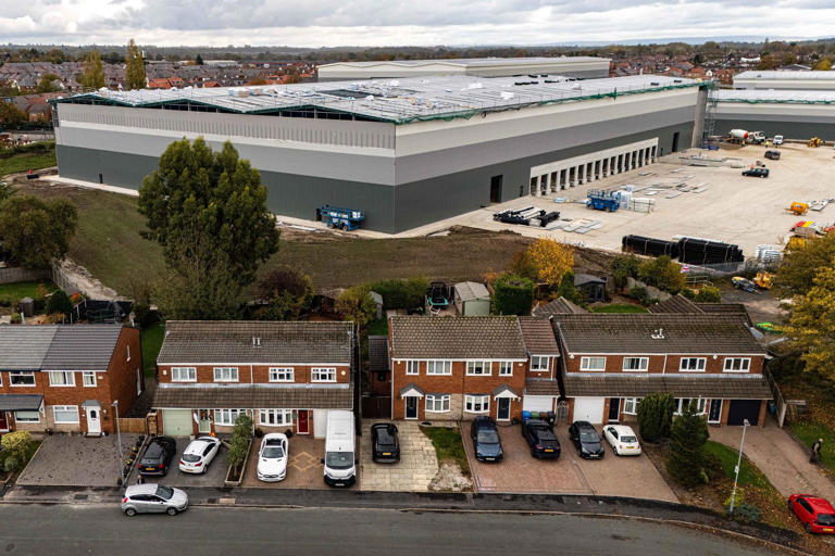 Wigan borough residents whose homes are dwarfed by new warehouses are ...
