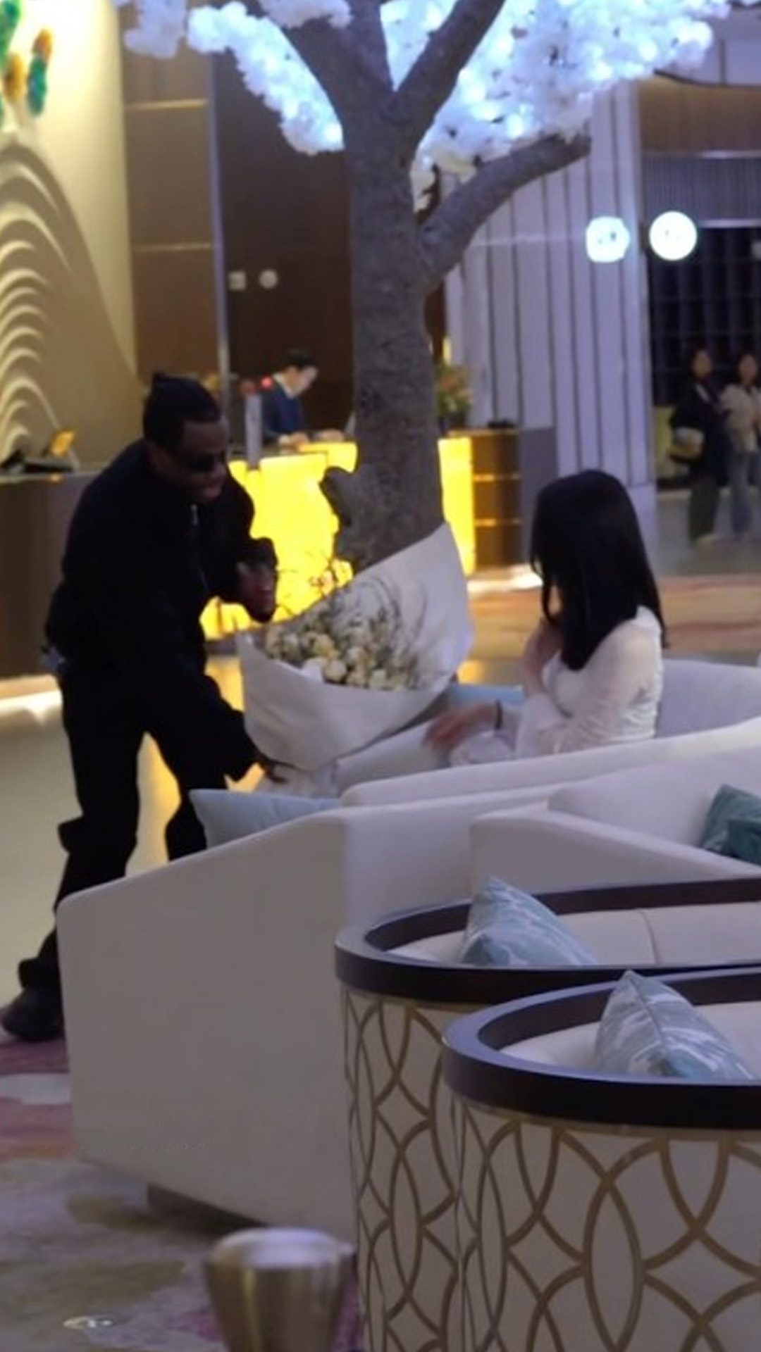 Happy reaction to unexpected bouquet